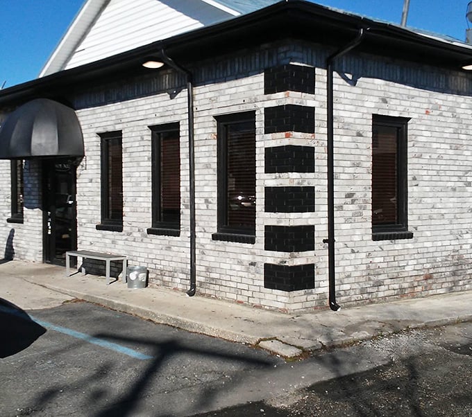 Black and white stripes with personality - this Charleston corner spot looks like a diner dressed for a party.