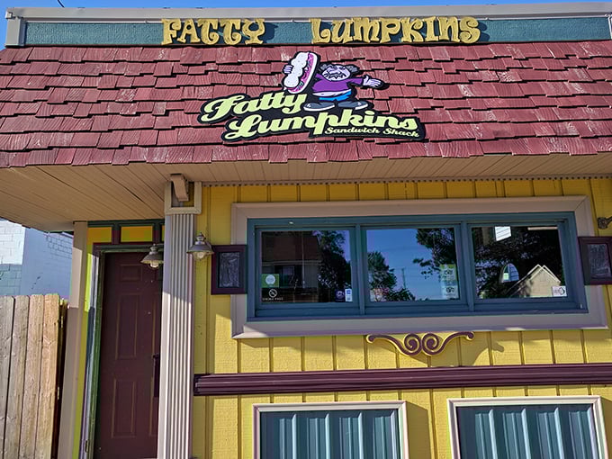 That cheerful yellow building with green chairs practically screams, "Best lunch decision you'll make today!"