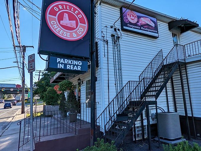 The cozy exterior of Grilled Cheese & Co. beckons comfort food seekers. That staircase might as well be the stairway to cheese heaven.