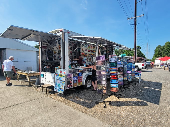 Mobile treasure troves line the market path. This vendor's colorful display could tempt even the most determined window-shopper.