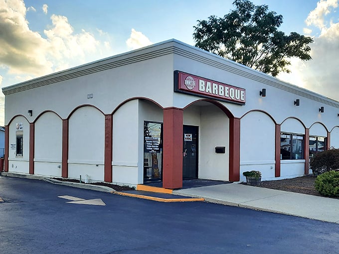 Classic strip mall exterior hiding serious barbecue credentials, like Clark Kent in a phone booth.