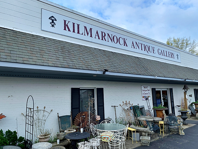 White walls and bold lettering announce this antiquing paradise. What treasures hide behind those unassuming doors?