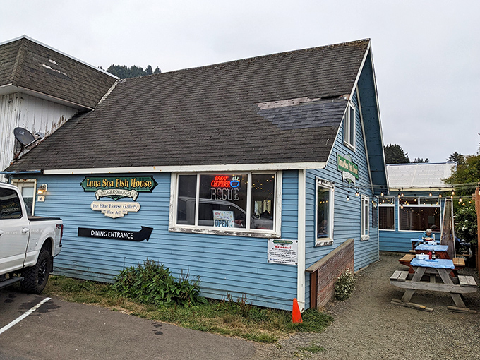 Classic fish house charm where weathered blue siding whispers tales of countless satisfied seafood lovers.