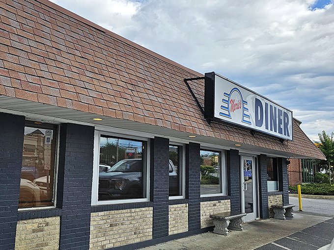 This blue and white facade whispers "home cooking" louder than any fancy restaurant ever could.