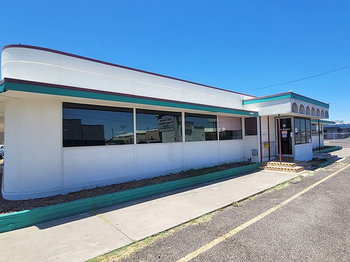 Classic white diner architecture meets desert sky - like stepping into a Norman Rockwell painting.