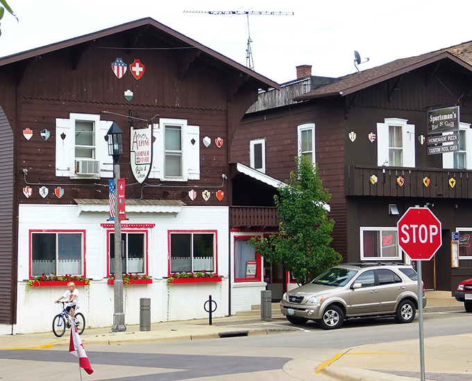 The warm glow of the sky bathes New Glarus's Main Street, where Swiss heritage meets Midwest hospitality in perfect harmony.