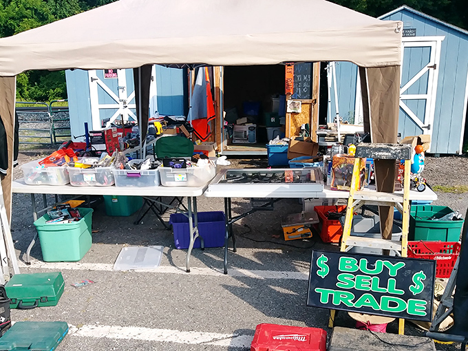 Tools and household goods spread across tables like a suburban archaeological dig waiting for discovery.