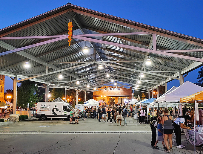 Evening lights illuminate a bustling market scene that transforms ordinary streets into bargain-hunting paradise.