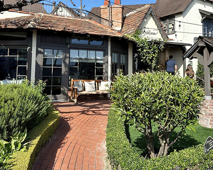 Brick pathways lead to culinary magic where ocean breezes meet perfectly grilled ribeye steaks.
