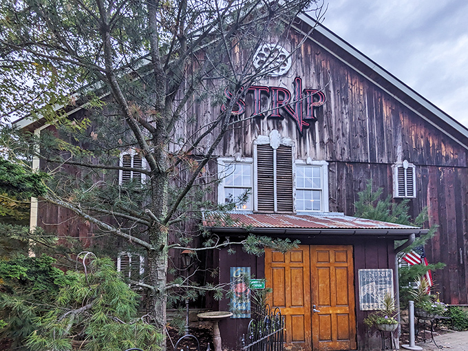 That weathered barn exterior isn't just for show&mdash;it's nature's way of saying "seriously good steaks happen here." Strip Steakhouse nails the farm-to-table vibe.