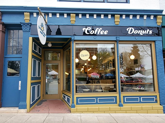 Where pendant lights cast a warm glow over coffee and donuts that make Monday mornings bearable again.