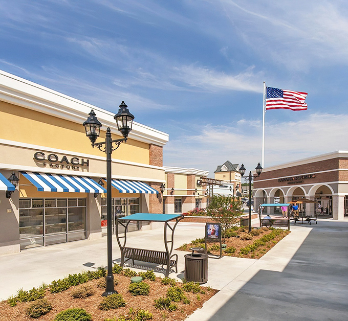Stars and stripes wave proudly over this outdoor shopping haven, making every purchase feel patriotically satisfying.