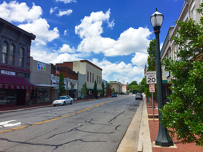 Classic brick buildings line these peaceful streets where time moves at a gentler pace.