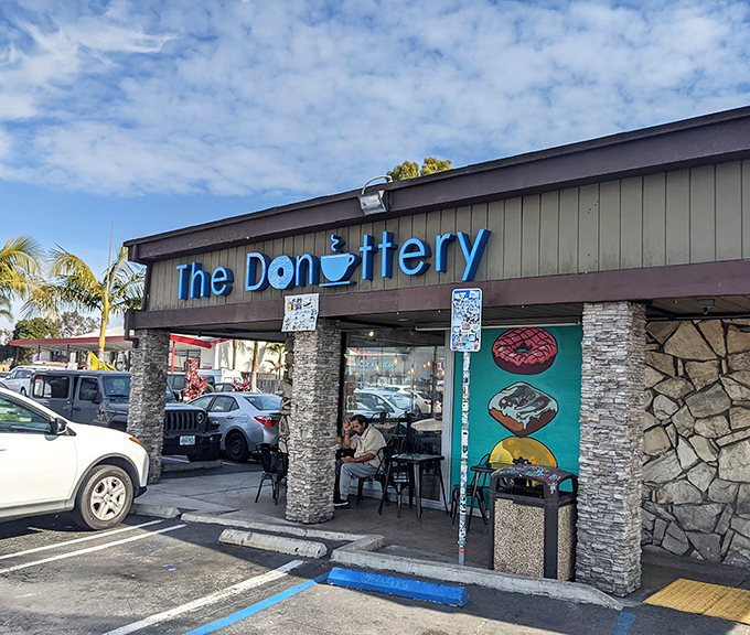 The Donuttery's sleek exterior hints at the timeless comfort waiting inside those glass doors.