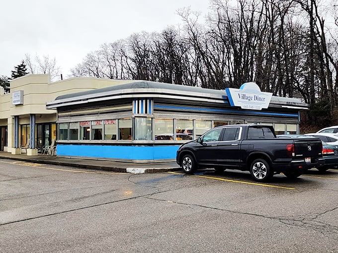Winter blues got you down? Village Diner's metallic charm stands defiant against gray skies, promising pancakes that'll warm you faster than Florida in February.