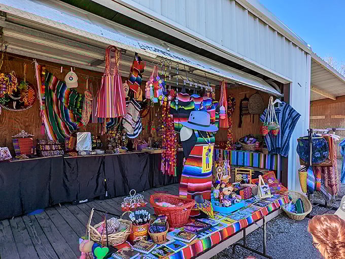 Fiesta in fabric form! These vibrant Mexican textiles transform a simple market stall into an explosion of joyful colors.