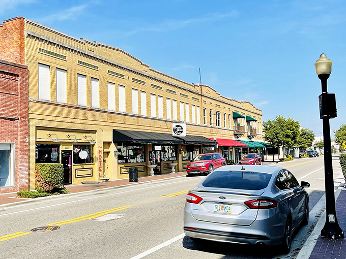 The golden-hued historic buildings of downtown Wauchula create a warm, welcoming atmosphere where neighbors still greet each other by name.
