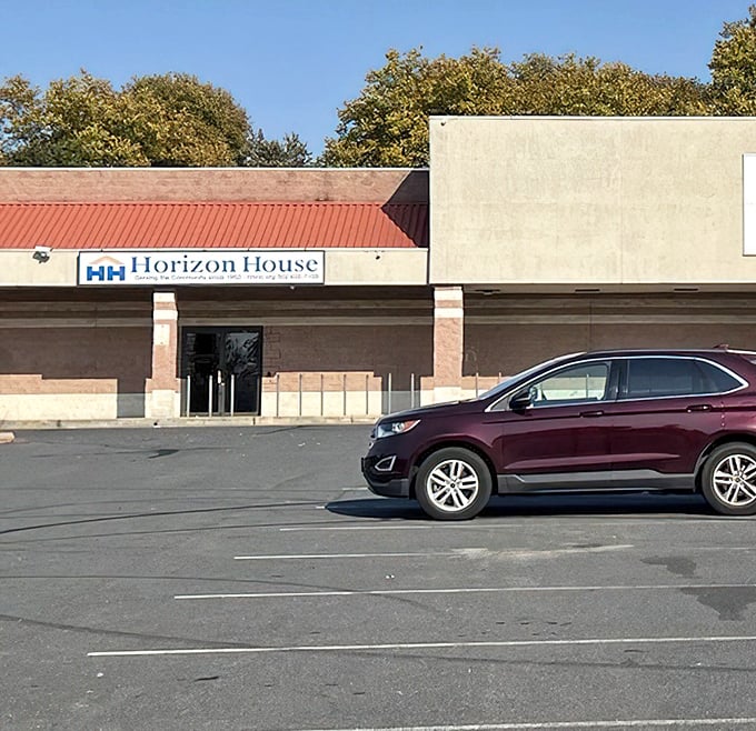 Indoor flea market bliss awaits behind these doors, where weather never dampens your treasure hunting spirit.