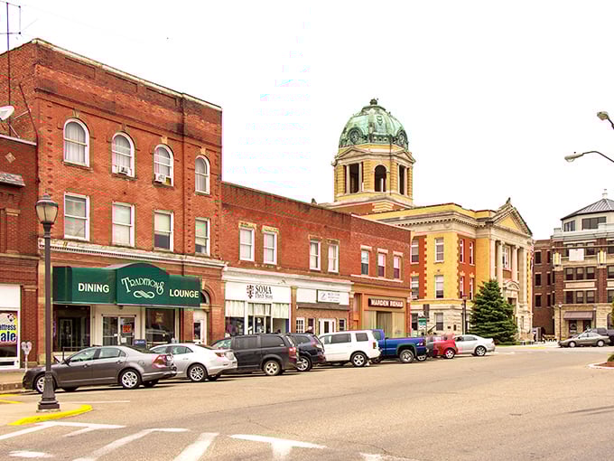 That magnificent courthouse dome in Woodsfield stands like a watchful guardian over a town where time moves deliciously slow.