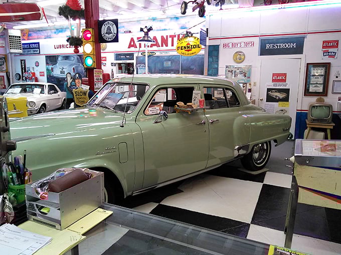 Mint-green perfection on checkerboard floors – this sedan has more mid-century swagger than Don Draper on casual Friday.