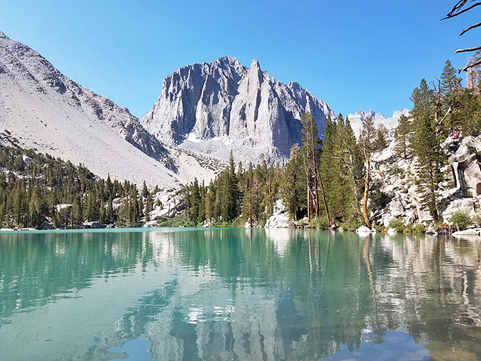 Big Pine Lakes serves up that impossible turquoise water that makes you question whether someone secretly poured in Caribbean food coloring.
