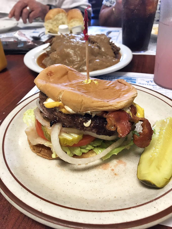 The legendary bison burger in all its glory &ndash; a towering masterpiece that makes regular burgers look like they're not even trying.