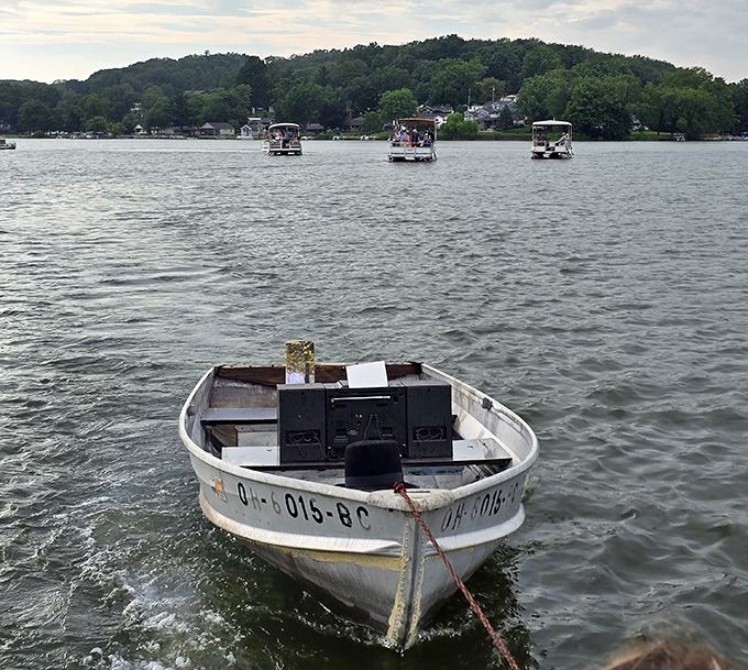 Pontoon boats drift by like floating living rooms, proving that hurrying is highly overrated on summer afternoons.