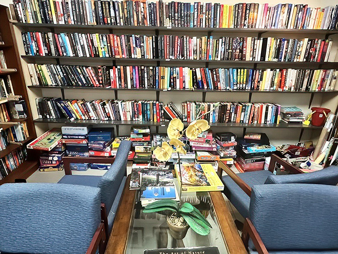 A bibliophile's dream corner where comfortable chairs invite you to sit and consider which literary companions will journey home with you.