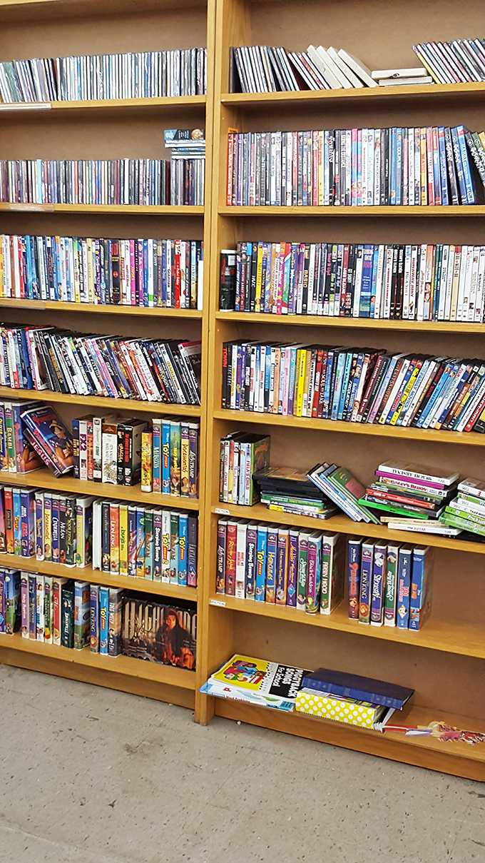 A bibliophile's dream come true &ndash; shelves packed with DVDs and books waiting for their next chapter in someone's home.