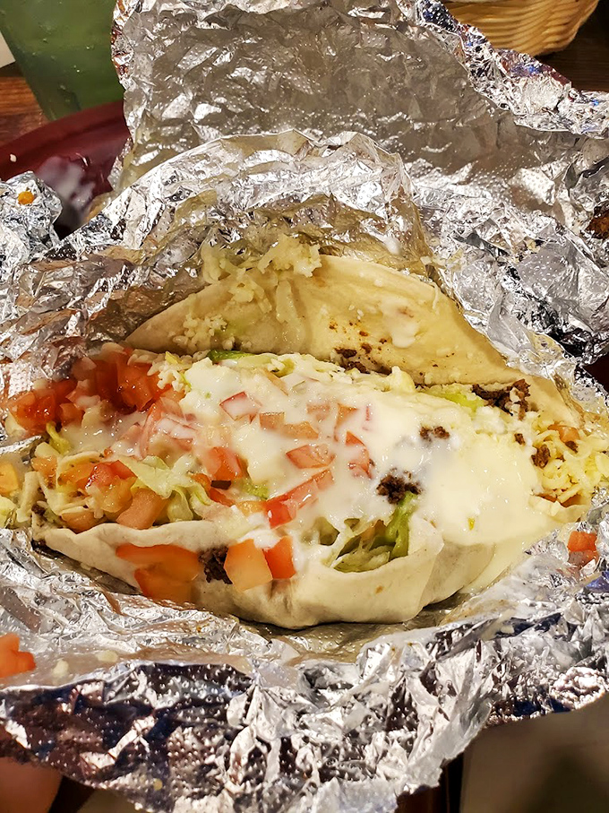 Behold the legendary foil-wrapped burrito in all its glory&mdash;cheese melting over perfectly seasoned meat with fresh toppings peeking through.