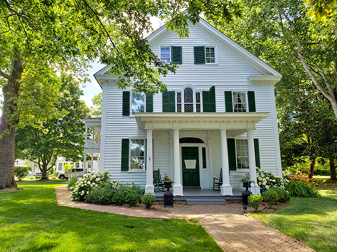 The pristine white Calvin B. Taylor House stands as a testament to Berlin's preserved history, its welcoming porch practically begging for a glass of sweet tea.