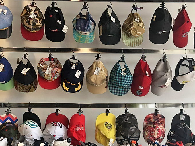 Baseball cap heaven! Like a rainbow of headwear possibilities, each one carrying stories from previous adventures while awaiting new ones.