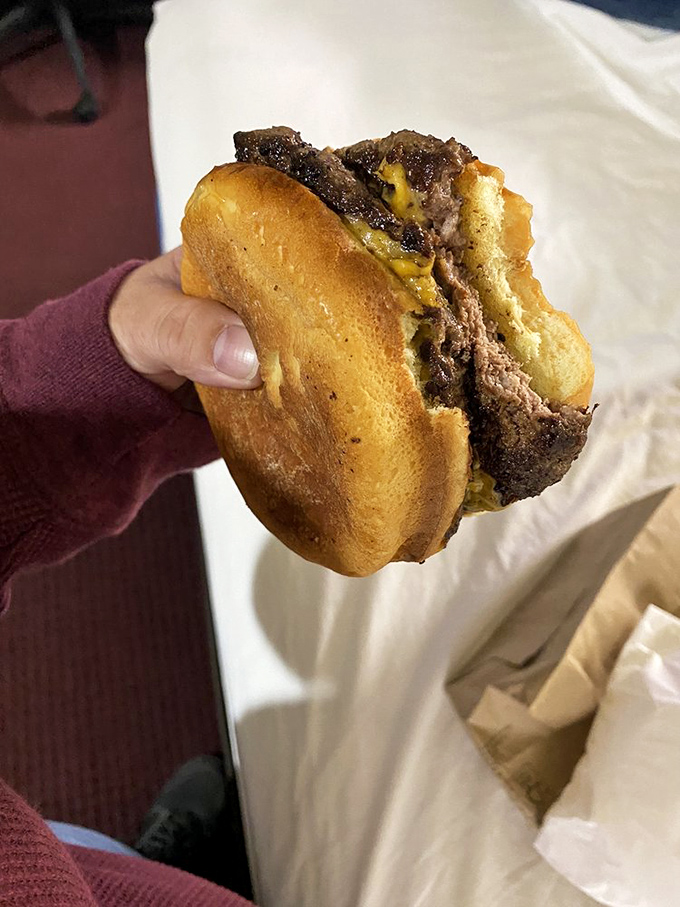 Behold the Double Grand: a burger so substantial it practically requires its own zip code and engineering degree.