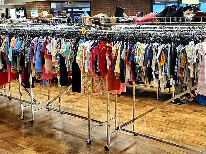 A rainbow of children's clothing awaits new adventures, each tiny garment holding stories and growth spurts of the past.