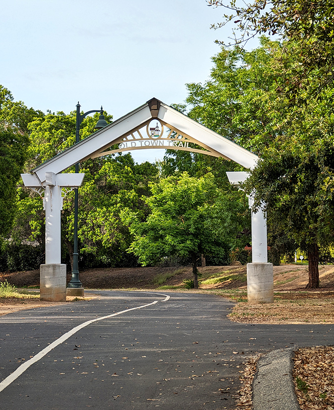 The Old Town Trail archway welcomes walkers, joggers, and those who just want to pretend they might exercise later.