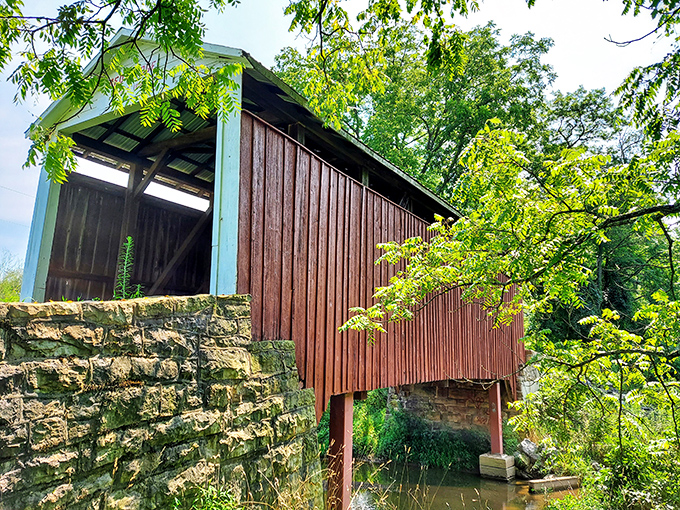 From this angle, you can appreciate how the bridge's sturdy stone foundations have anchored it against time and elements for over a century.