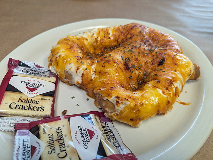 The legendary crab pretzel in all its glory&mdash;a soft, chewy base smothered in creamy crab dip and melted cheese. Resistance is futile. 