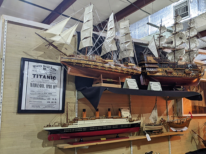 Nautical nostalgia at its finest! These meticulously crafted model ships sail through time alongside a haunting Titanic advertisement, reminding us of maritime history's enduring fascination. 