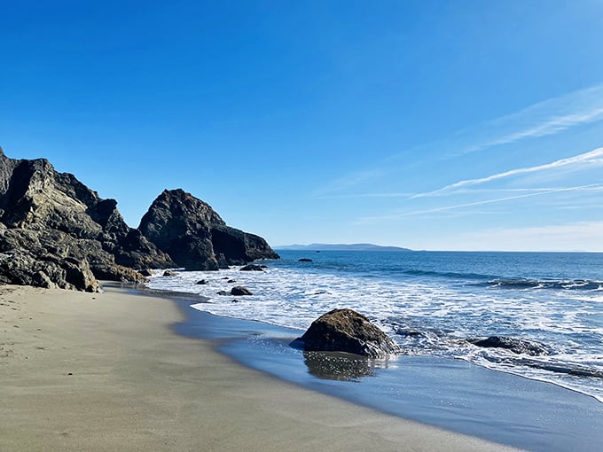Nature's perfect canvas: where golden sand meets azure waters, and stress dissolves faster than salt in the Pacific.