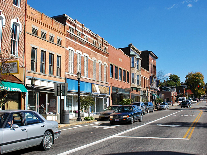 Sunlight plays across the warm brick facades of downtown Millersburg, where vintage lampposts and classic storefronts create a living museum of American small-town architecture.