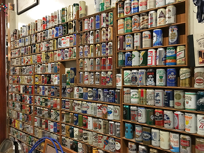 The wall of vintage beer cans stands as a fizzy time capsule of American advertising history—each can a snapshot of graphic design evolution.