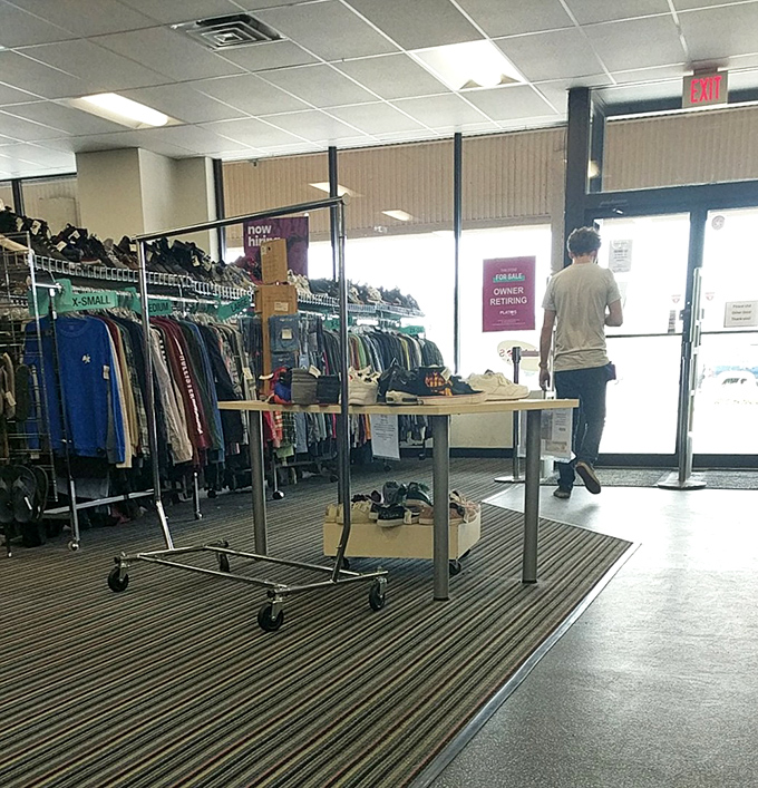 The threshold of transformation, where shoppers enter with $35 and exit with enough style to fool their high-rolling friends.