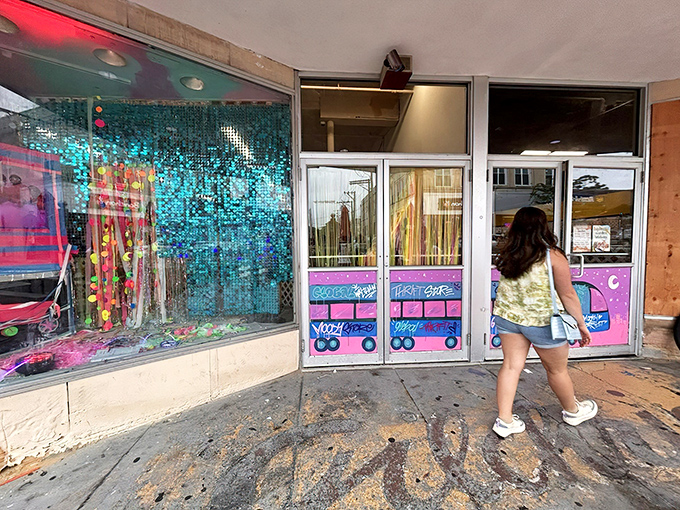 The colorful entrance with its vibrant pink and blue accents invites shoppers in with a promise of retail adventure.