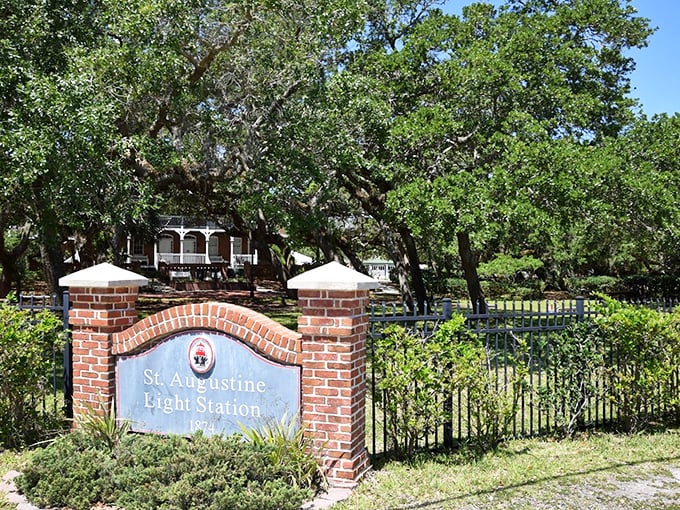 The entrance sign welcomes visitors beneath ancient oak trees, promising maritime adventures and ghost stories in equal measure.