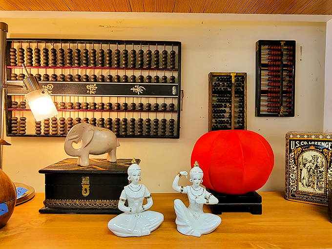 Ancient abacuses meet spiritual figurines in this eclectic corner. That bright red sphere? Someone's statement piece is just waiting to make a living room pop!
