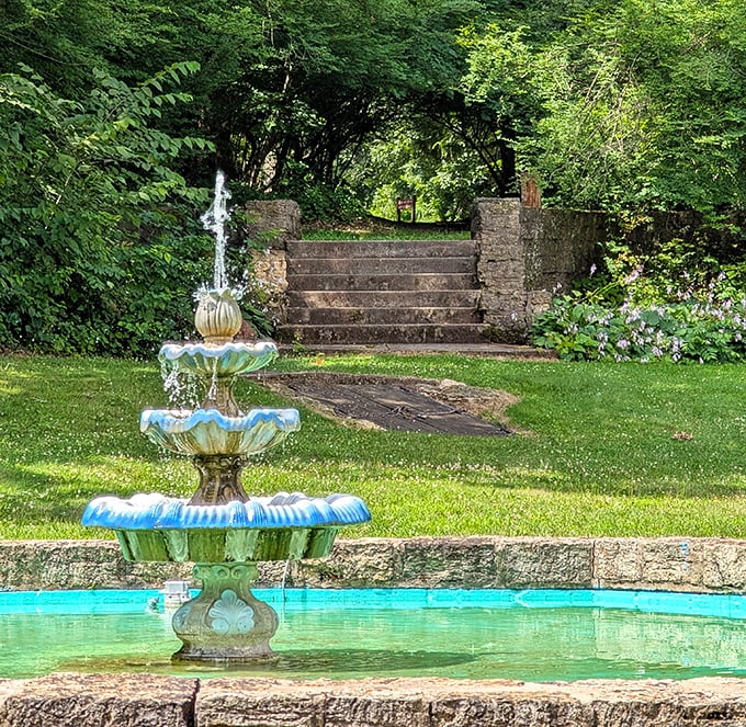 A tiered fountain adds Mediterranean charm to the grounds, its gentle cascade providing the perfect soundtrack for contemplative strolls through the estate.