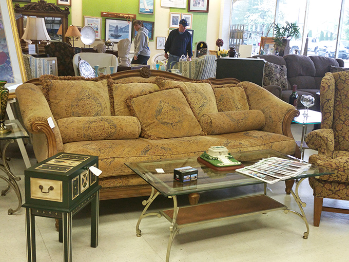 That golden floral sofa could tell stories of beach house gatherings and family game nights. Classic furniture finds await the patient treasure hunter. 
