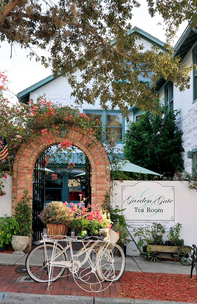 The Garden Gate Tea Room welcomes visitors through a flower-draped brick archway. Even non-tea drinkers will feel their pinkies involuntarily rising at the sight.