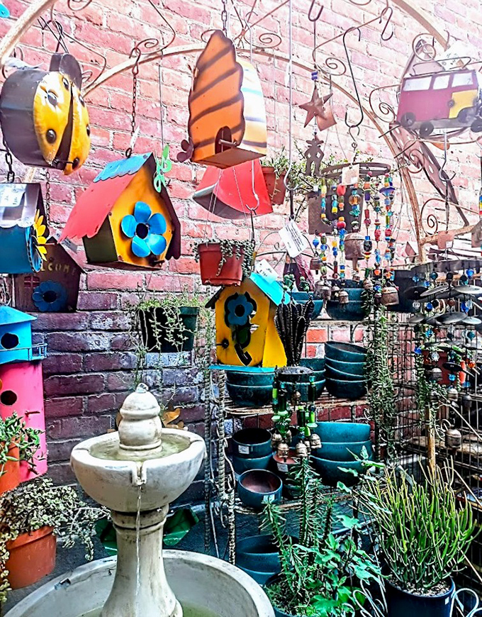 The garden area explodes with whimsy&mdash;vibrant birdhouses, a serene fountain, and metal art create an outdoor treasure trove that would make Martha Stewart swoon.