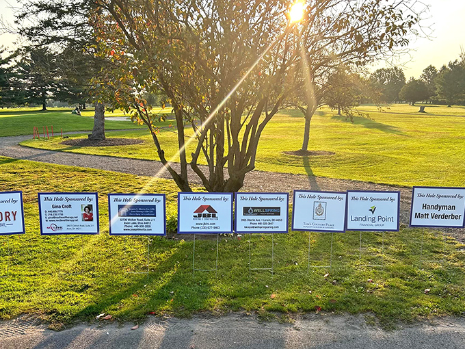 Golden hour transforms these community grounds into a postcard-worthy scene, where sponsored holes hint at local business support.